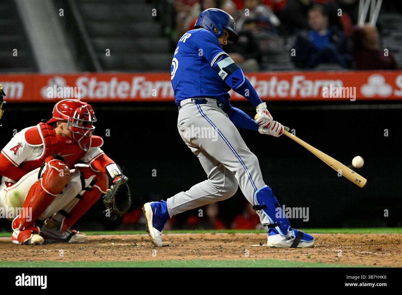 Toronto Blue Jays' Anthony Santander, right, hits a solo home run next ...