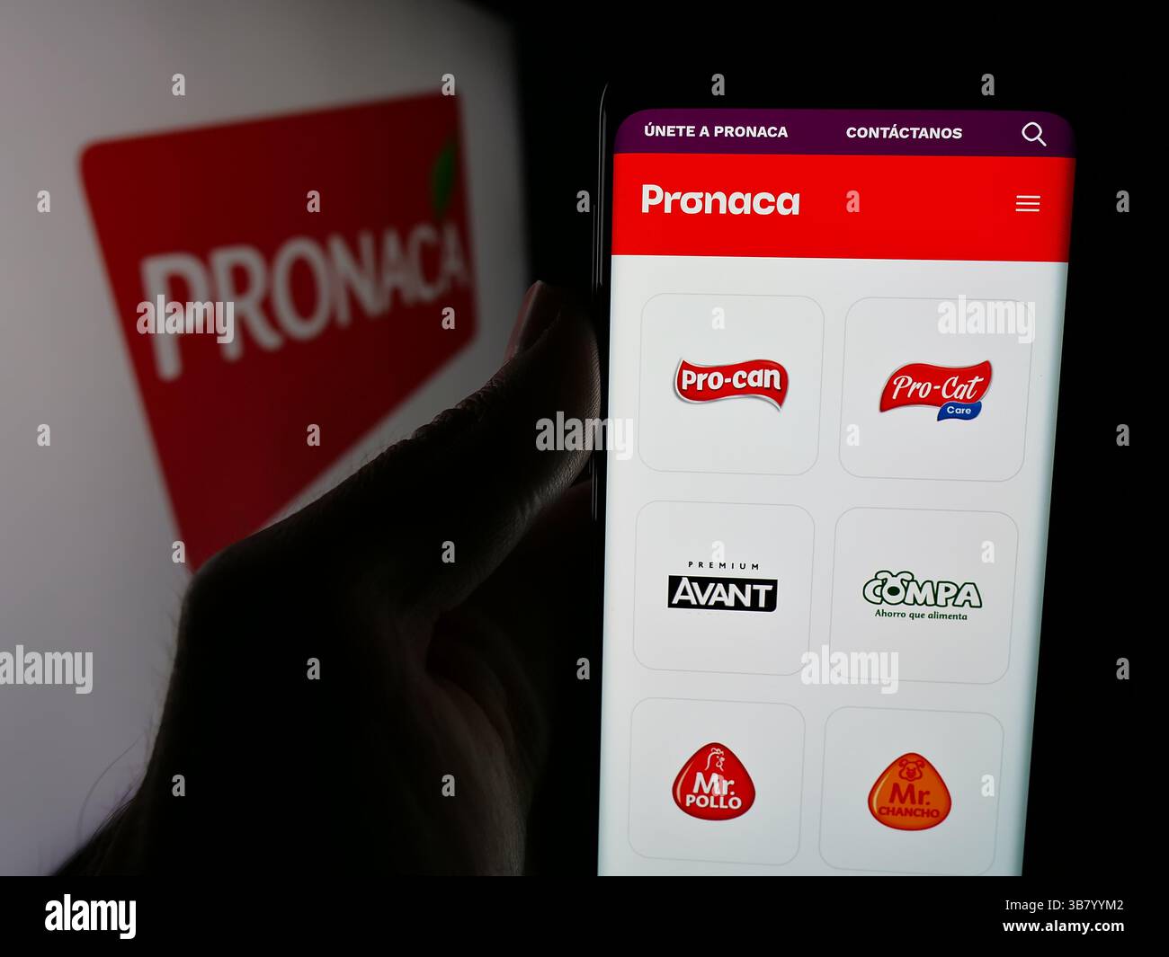 In this photo illustration, a person is holding a cellphone with the ...