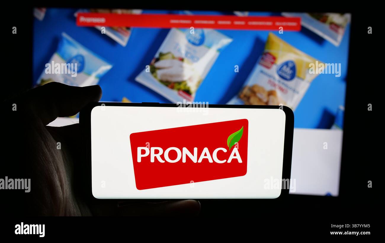 In this photo illustration, a person is holding a cellphone with the ...