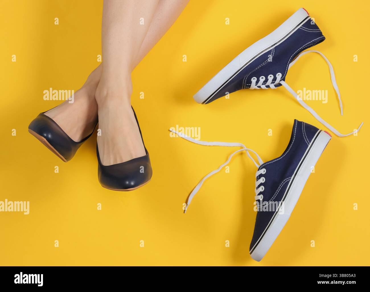 Female legs in classic high heel shoes on a yellow background with ...