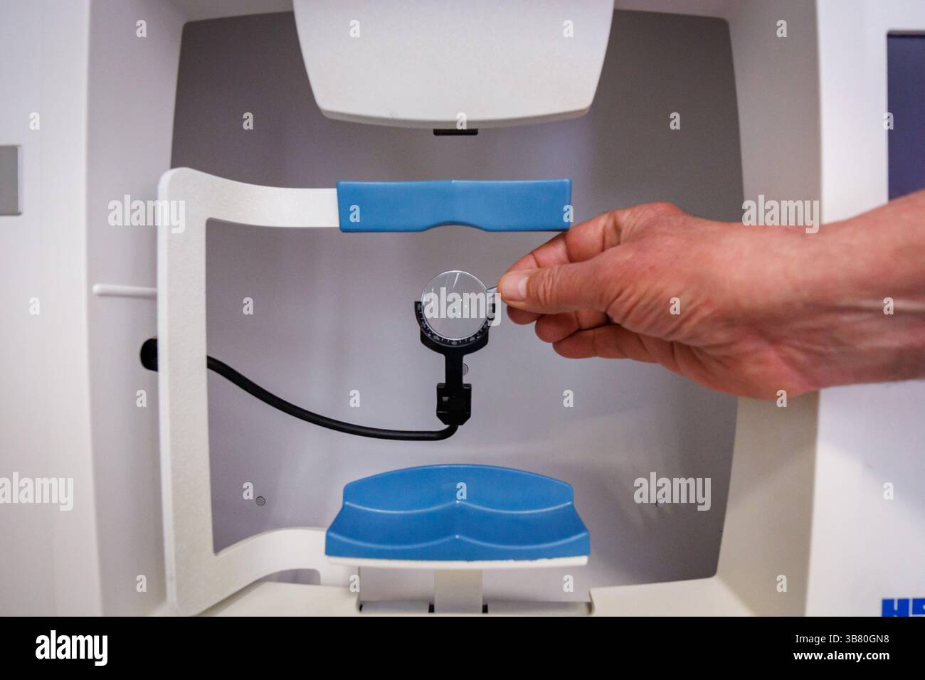 23 May 2024, Bavaria, Erlangen: A dioptric lens is placed on a ...