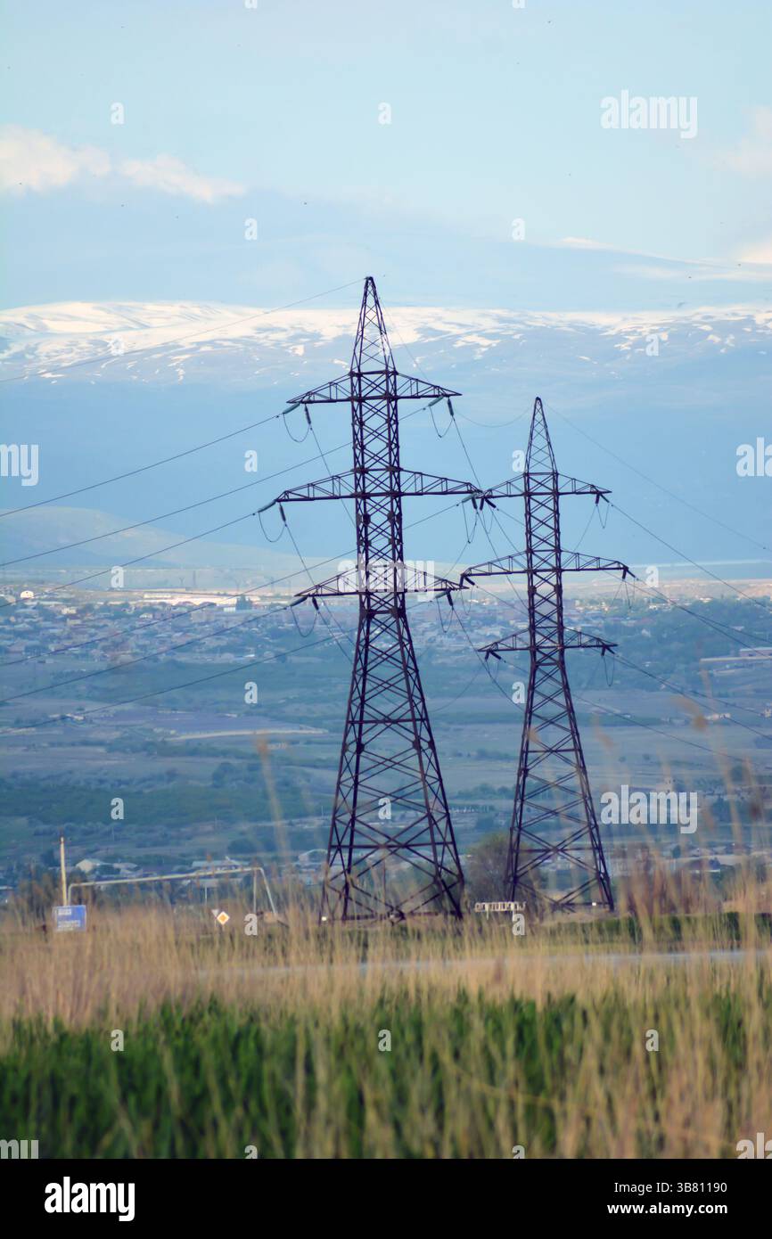 High voltage power lines and electricity transmission. Towers for ...