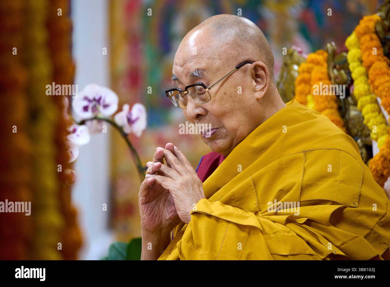 Tibetan spiritual leader the Dalai Lama prays at an event during which ...