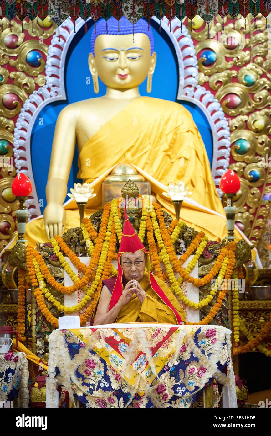 Tibetan spiritual leader the Dalai Lama wears a ceremonial hat at an ...