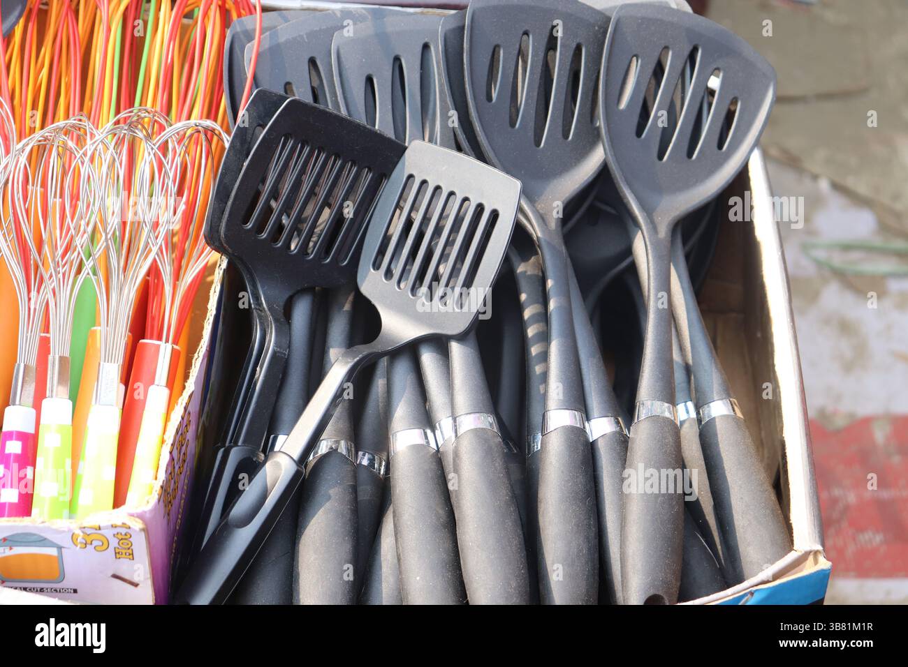 Up-close shot displays an organized collection of black slotted ...
