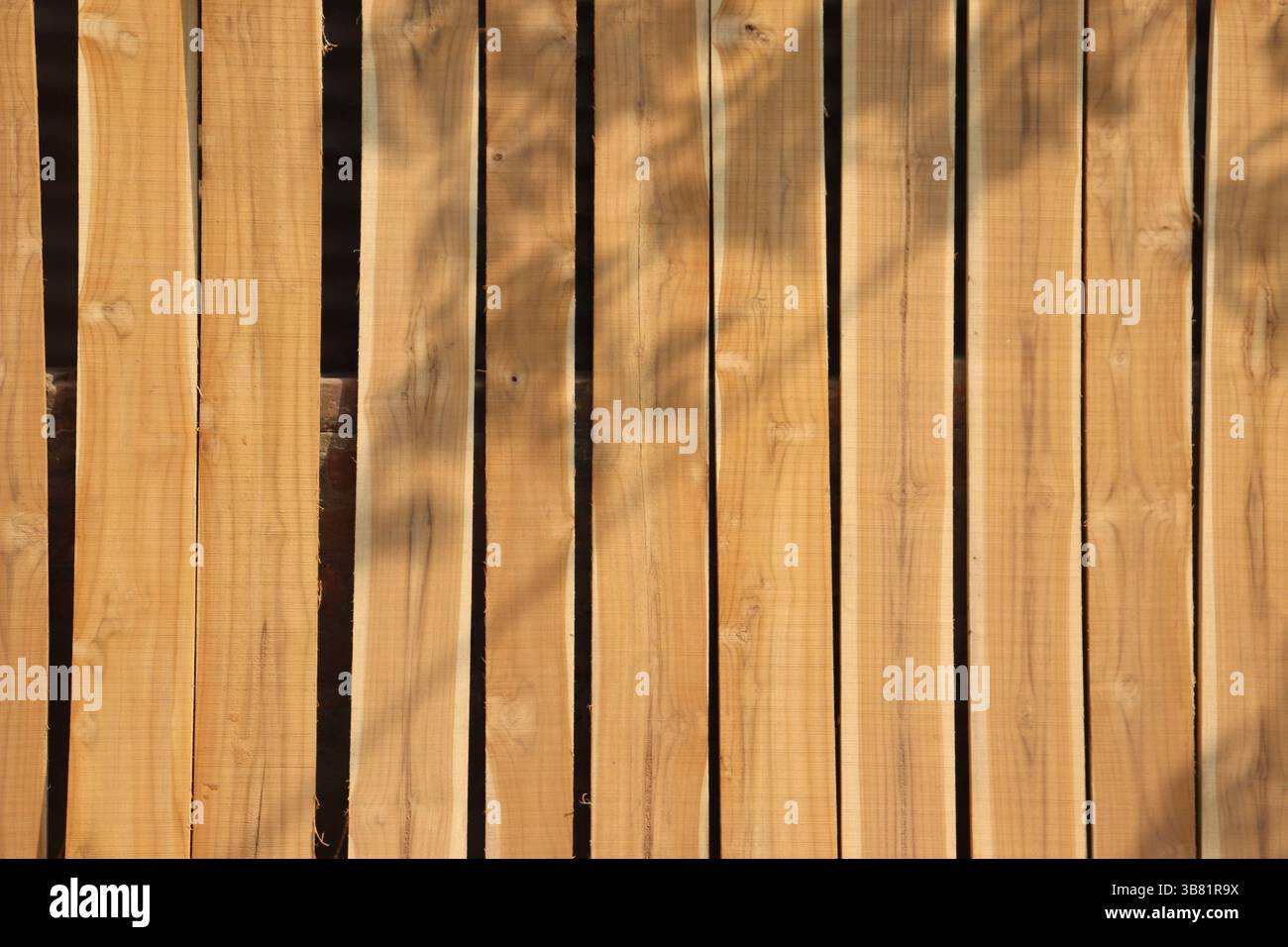 This detailed close up shows a set of tightly packed parallel wooden ...