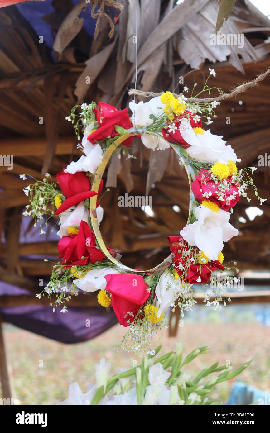 Delicate floral arrangement features white gladiolus, red roses, and ...