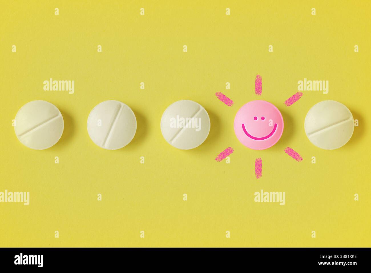 Pills in a row and pill with a happy face on yellow background ...