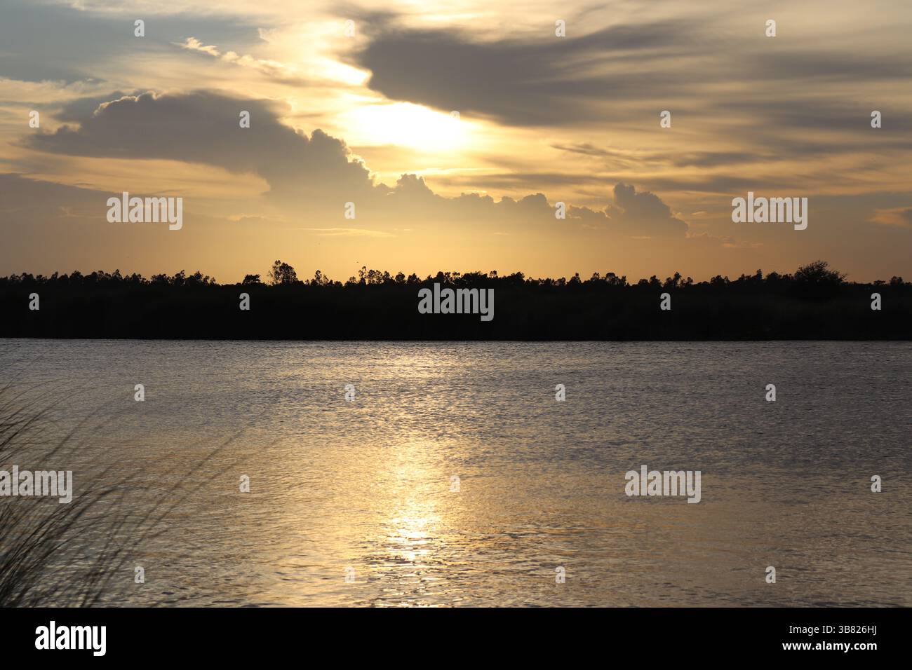 Stunning scenic shot showcasing a reflective water body under a vibrant ...