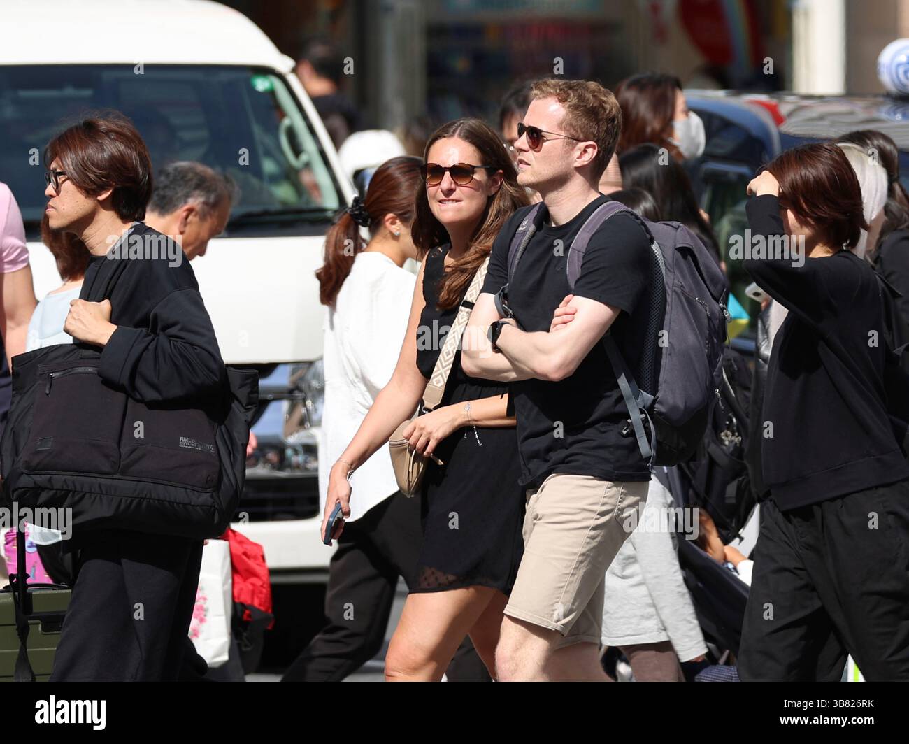 People walk amid comfortable amid comfortable temperature at Ginza ...