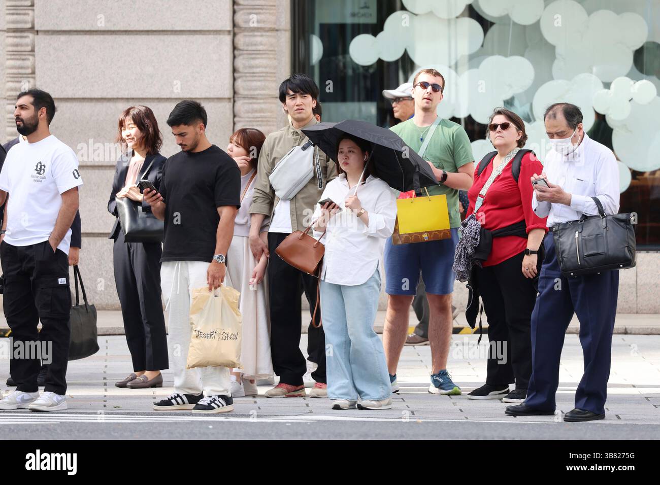 People walk amid comfortable amid comfortable temperature at Ginza ...