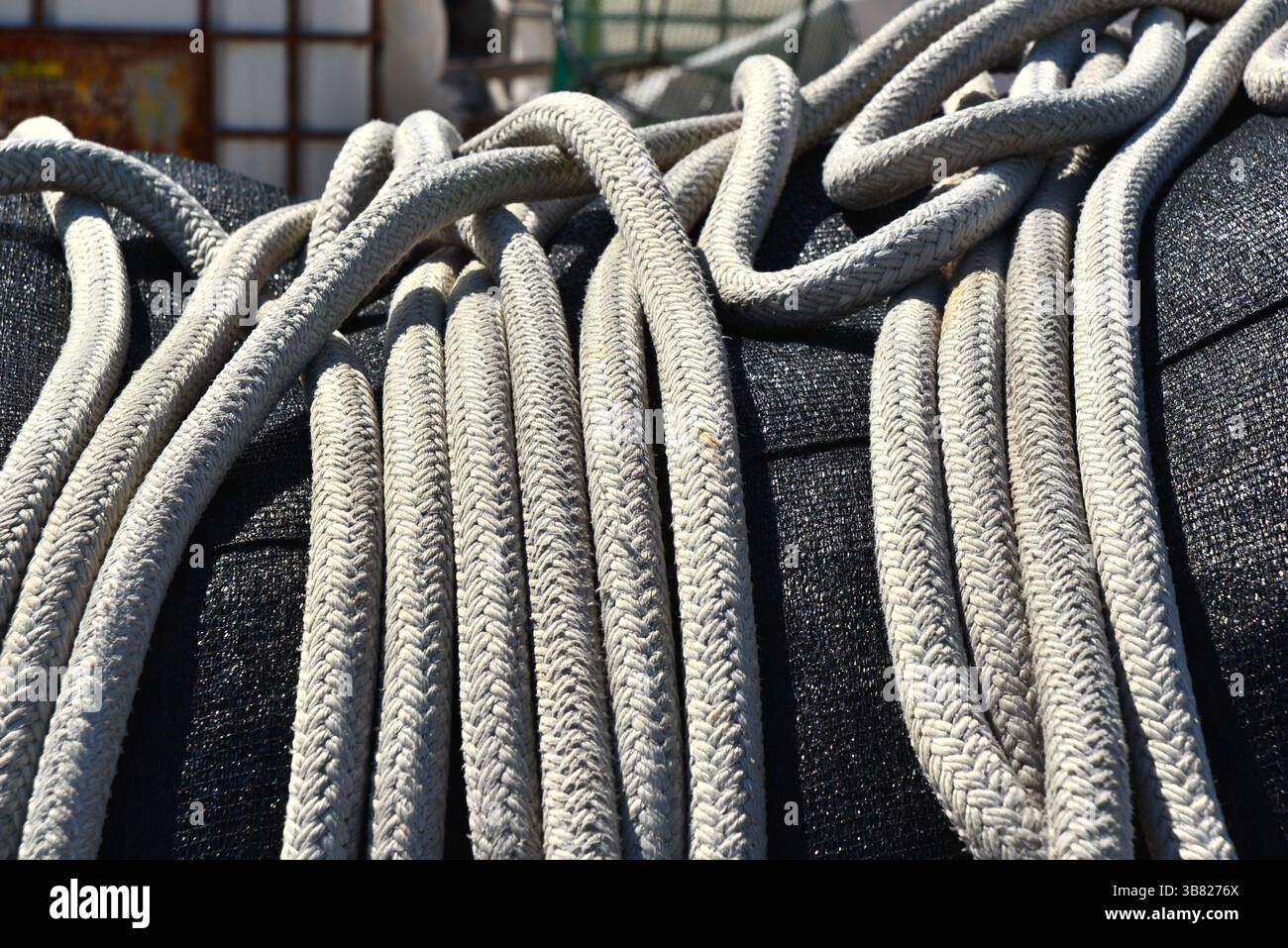 Fisherman's rope coiled on itself Stock Photo - Alamy