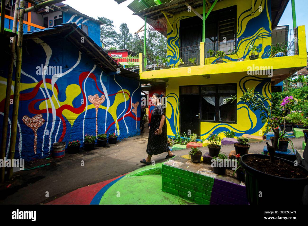 Bandung, Indonesia. 7th May, 2025. A woman walks at Katumbiri village ...