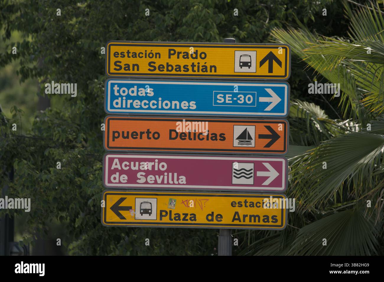 Colorful road signs in Seville, Andalusia, Spain, showing directions to ...