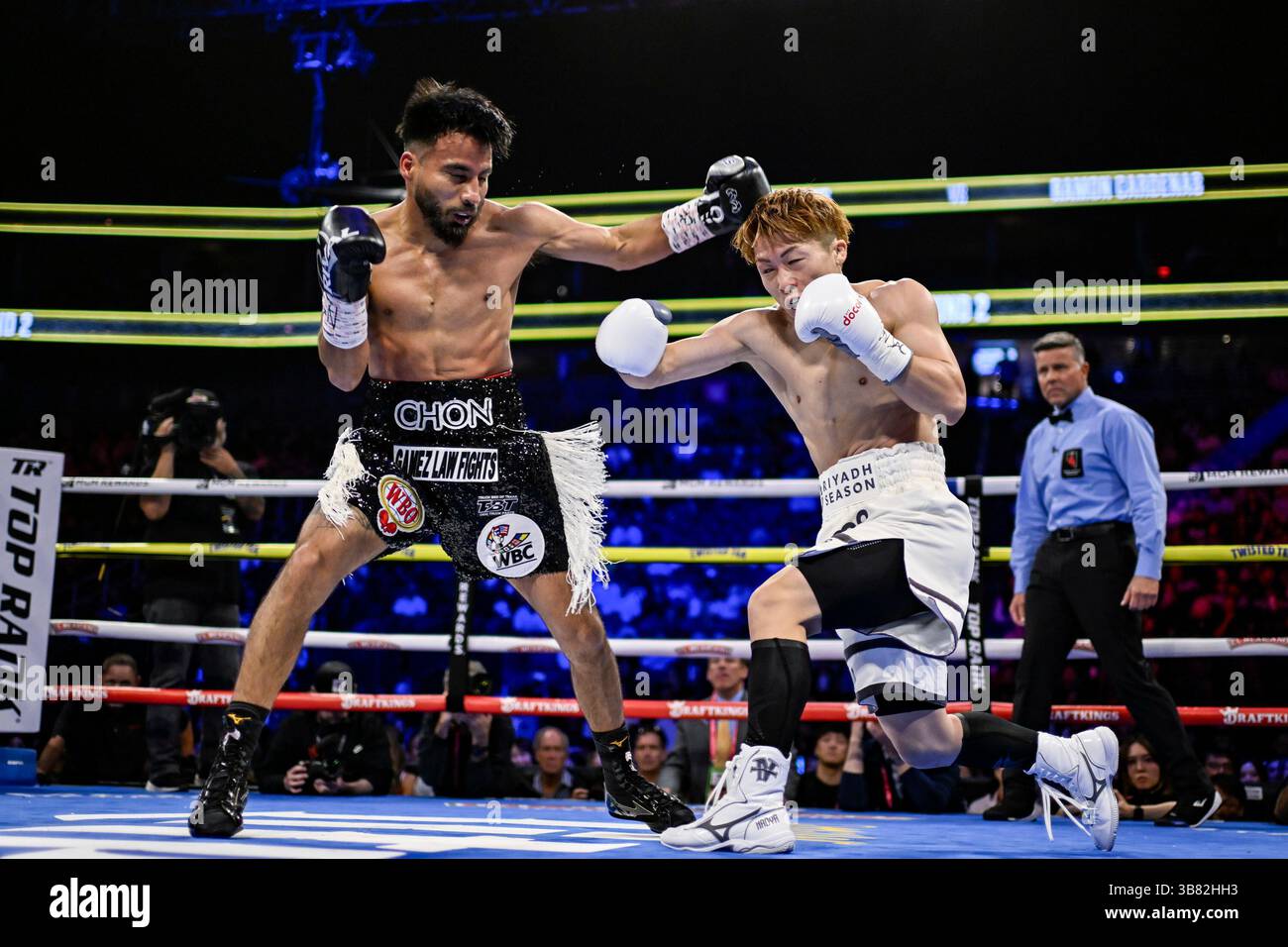Champion Naoya Inoue (white gloves) of Japan and Ramon Cardenas (black ...