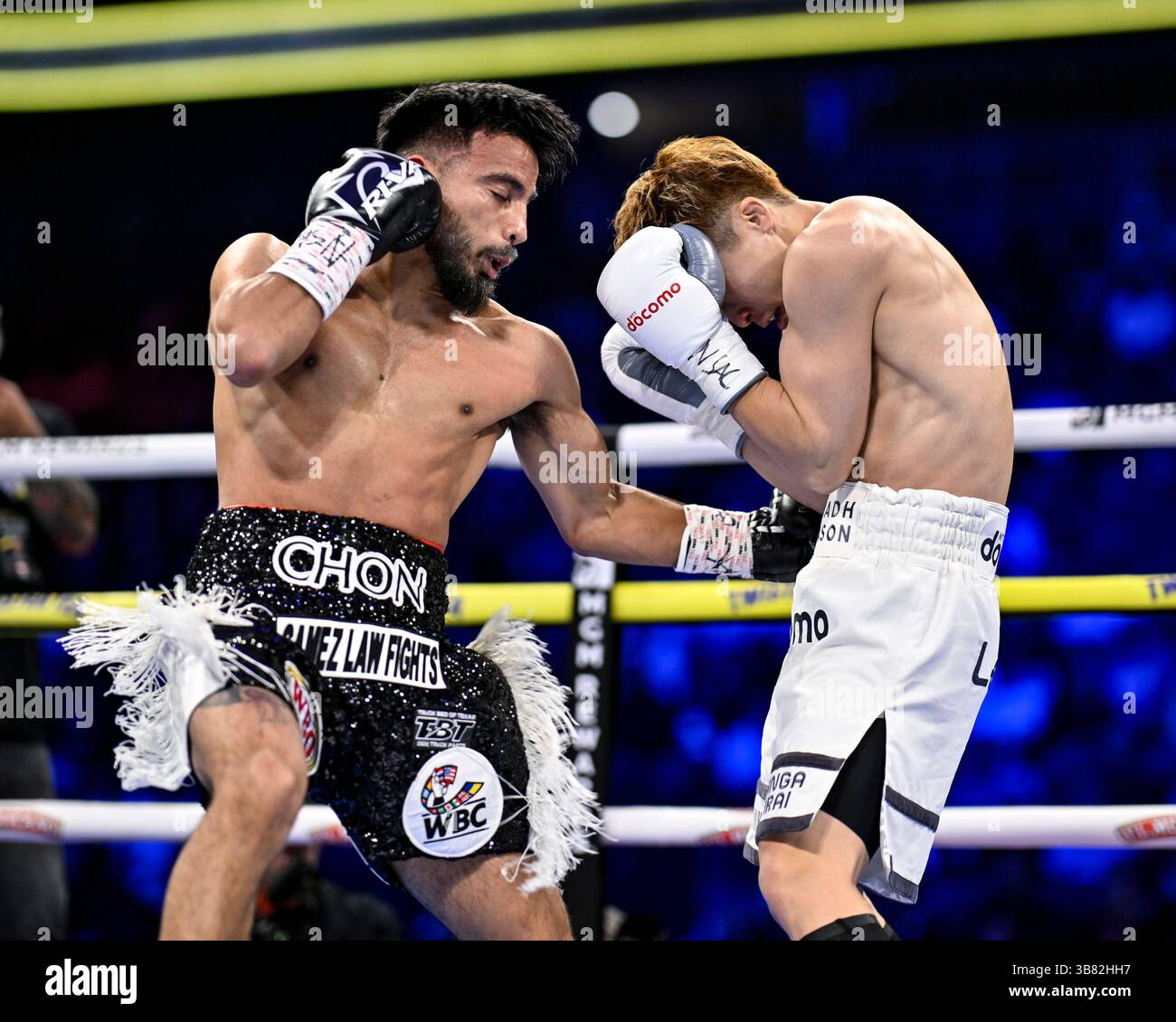 Champion Naoya Inoue (white gloves) of Japan and Ramon Cardenas (black ...