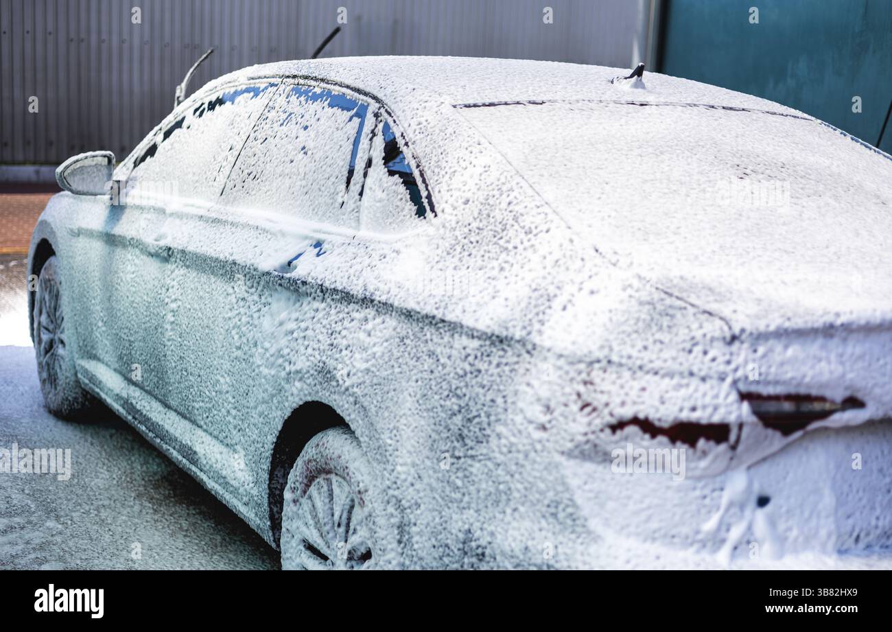 Manual car wash with high pressure washing outside Stock Photo - Alamy