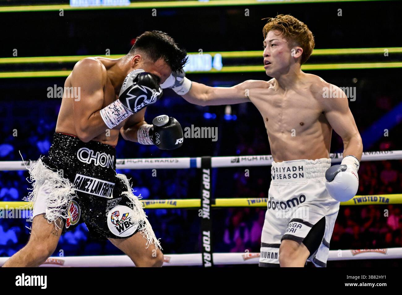 Champion Naoya Inoue (white gloves) of Japan and Ramon Cardenas (black ...