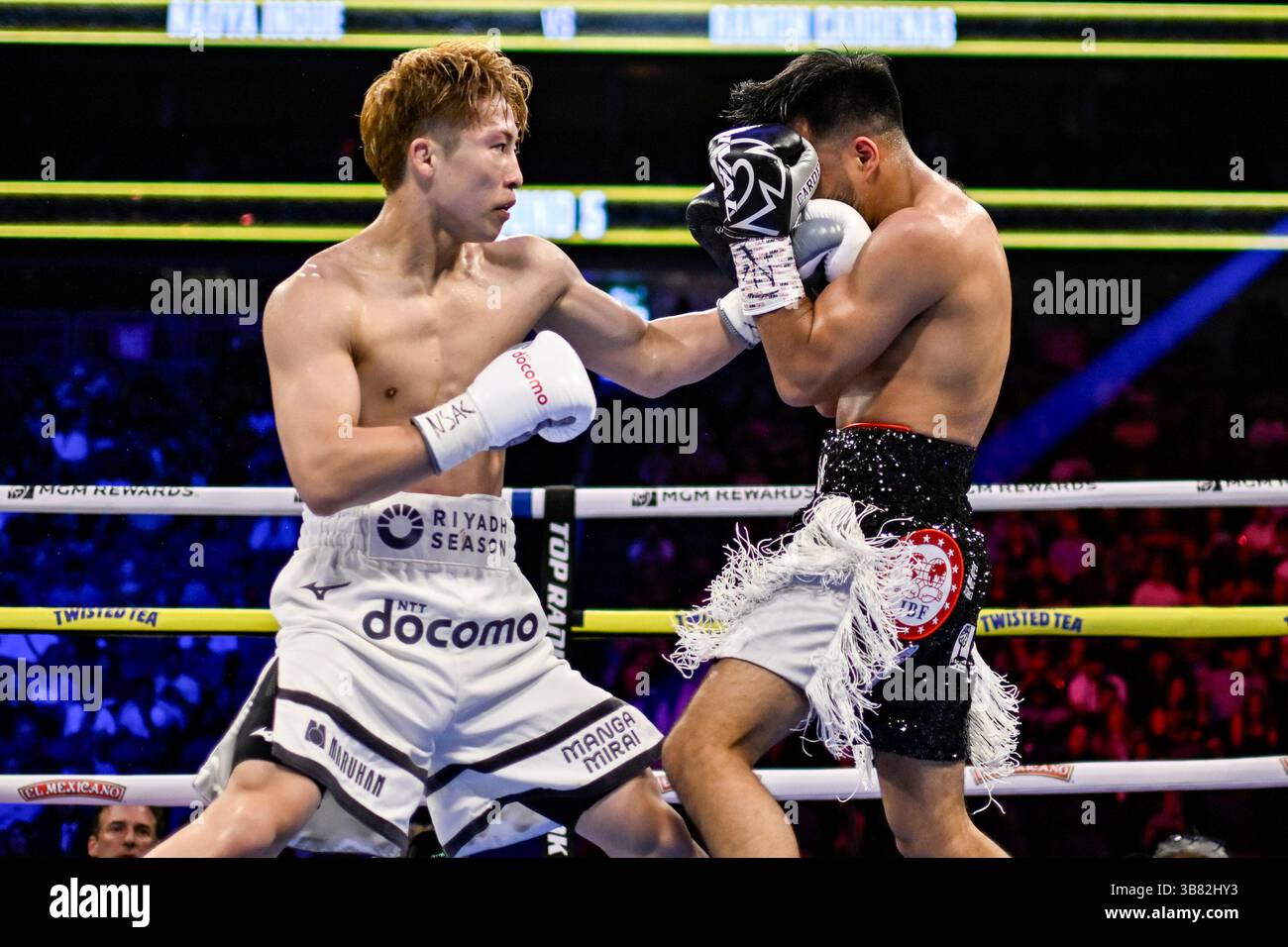 Champion Naoya Inoue (white gloves) of Japan and Ramon Cardenas (black ...
