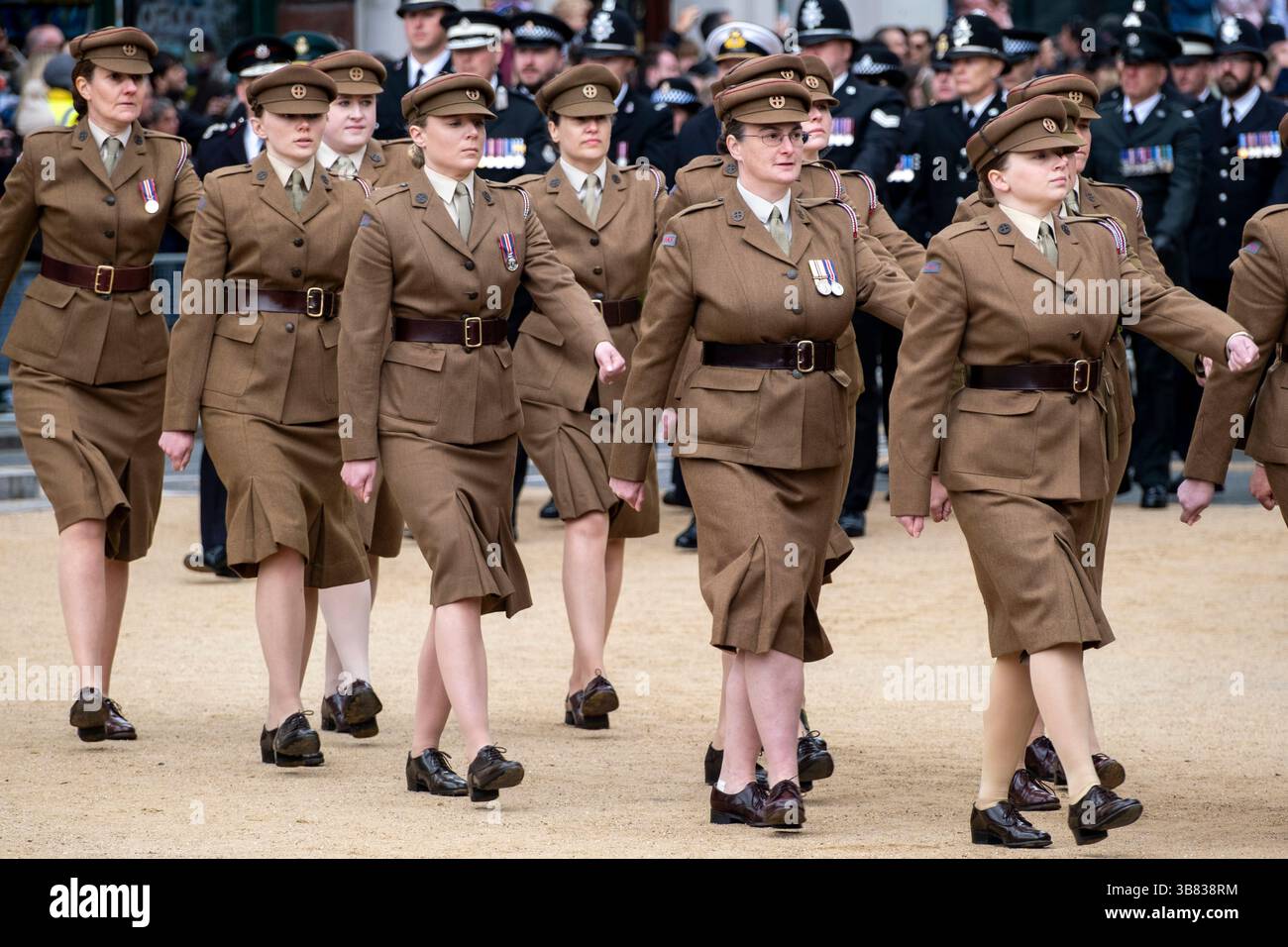 Members of the armed forces take part in the military procession along ...