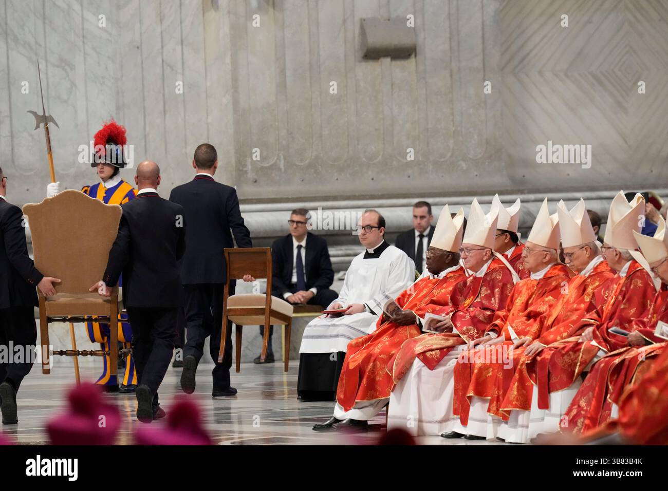 A chair is taken away at the end of a final Mass celebrated by ...