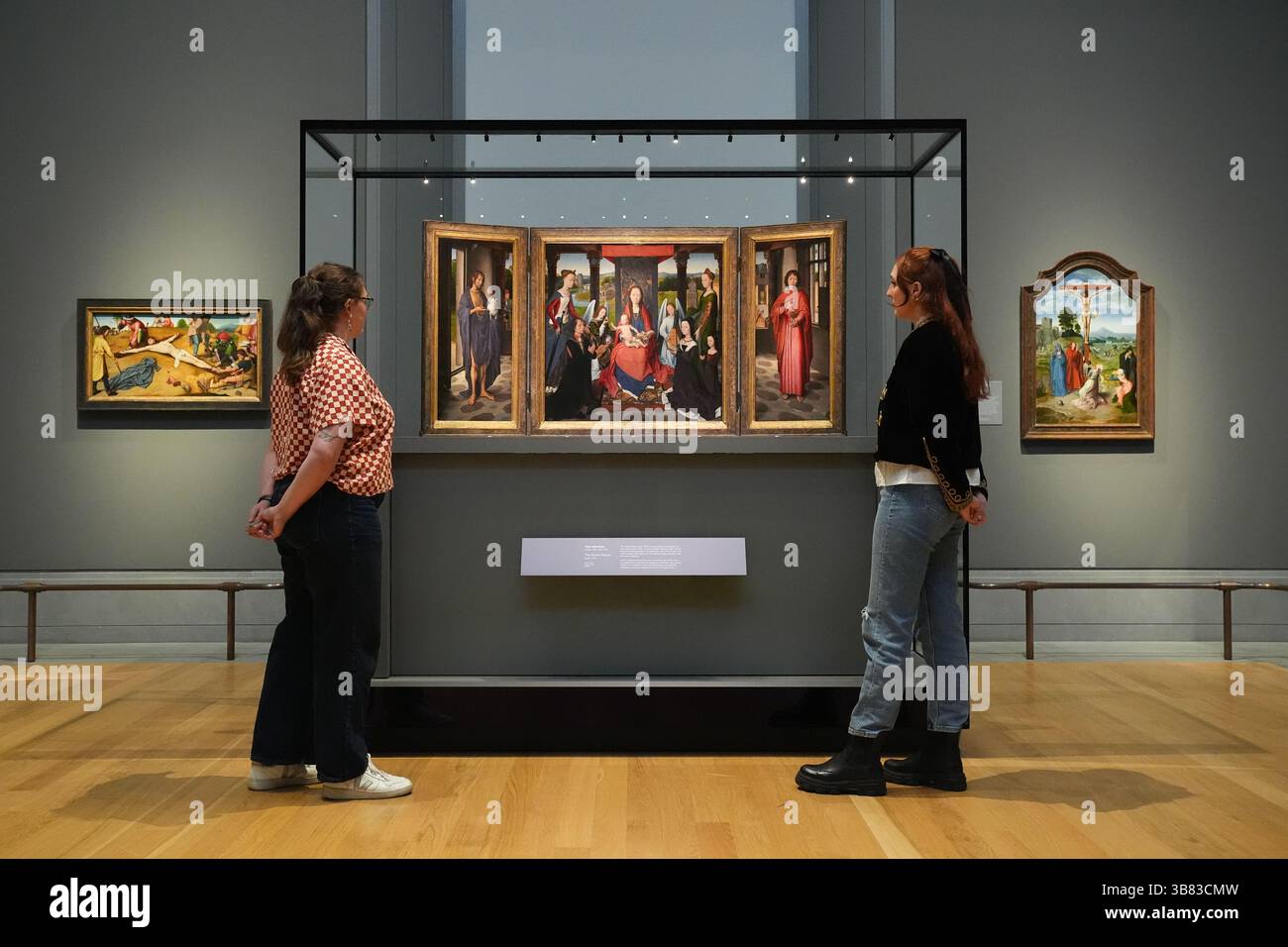 People look at "Donne Triptych" by Hans Memling on display during a preview of the CC Land: The ...
