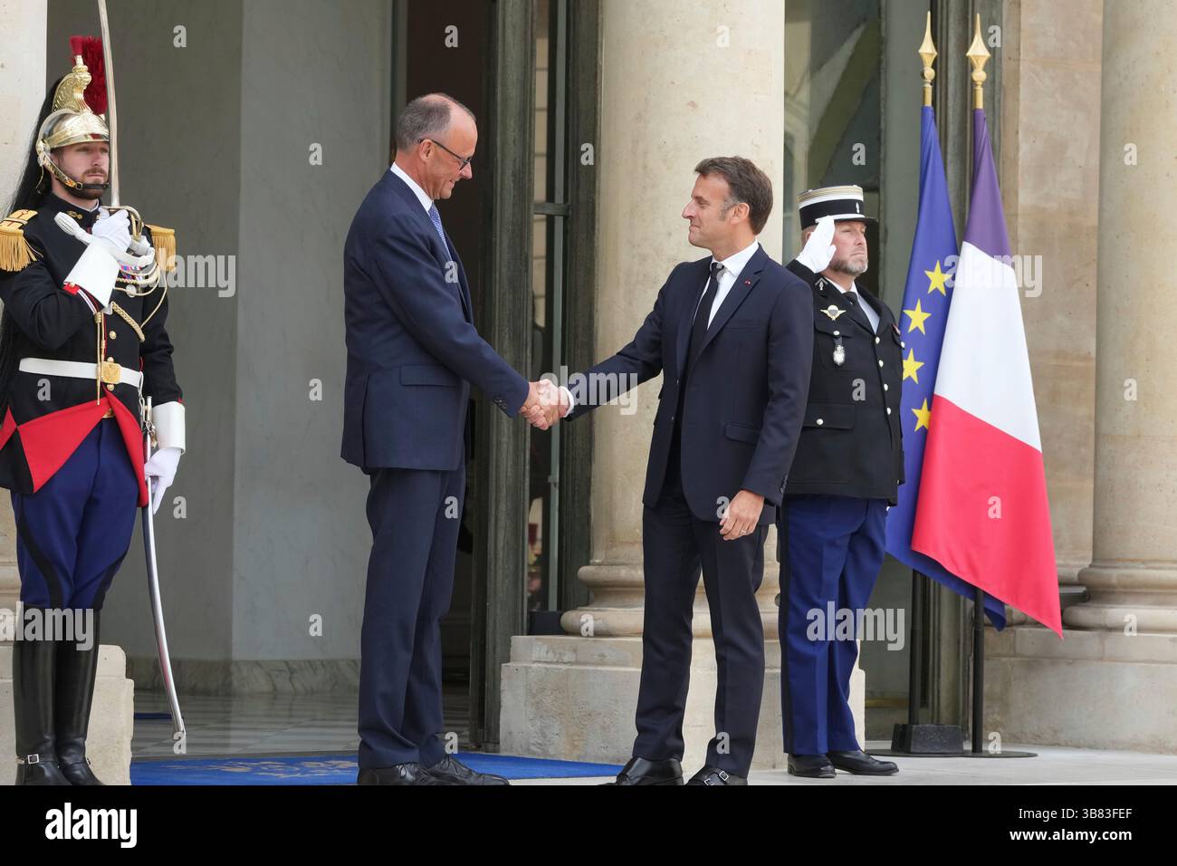 French President Emmanuel Macron, right, welcomes German Chancellor ...