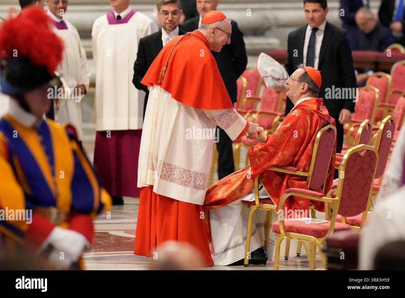 Cardinal Pietro Parolin, center, greets Cardinal Giovanni Lajolo during ...