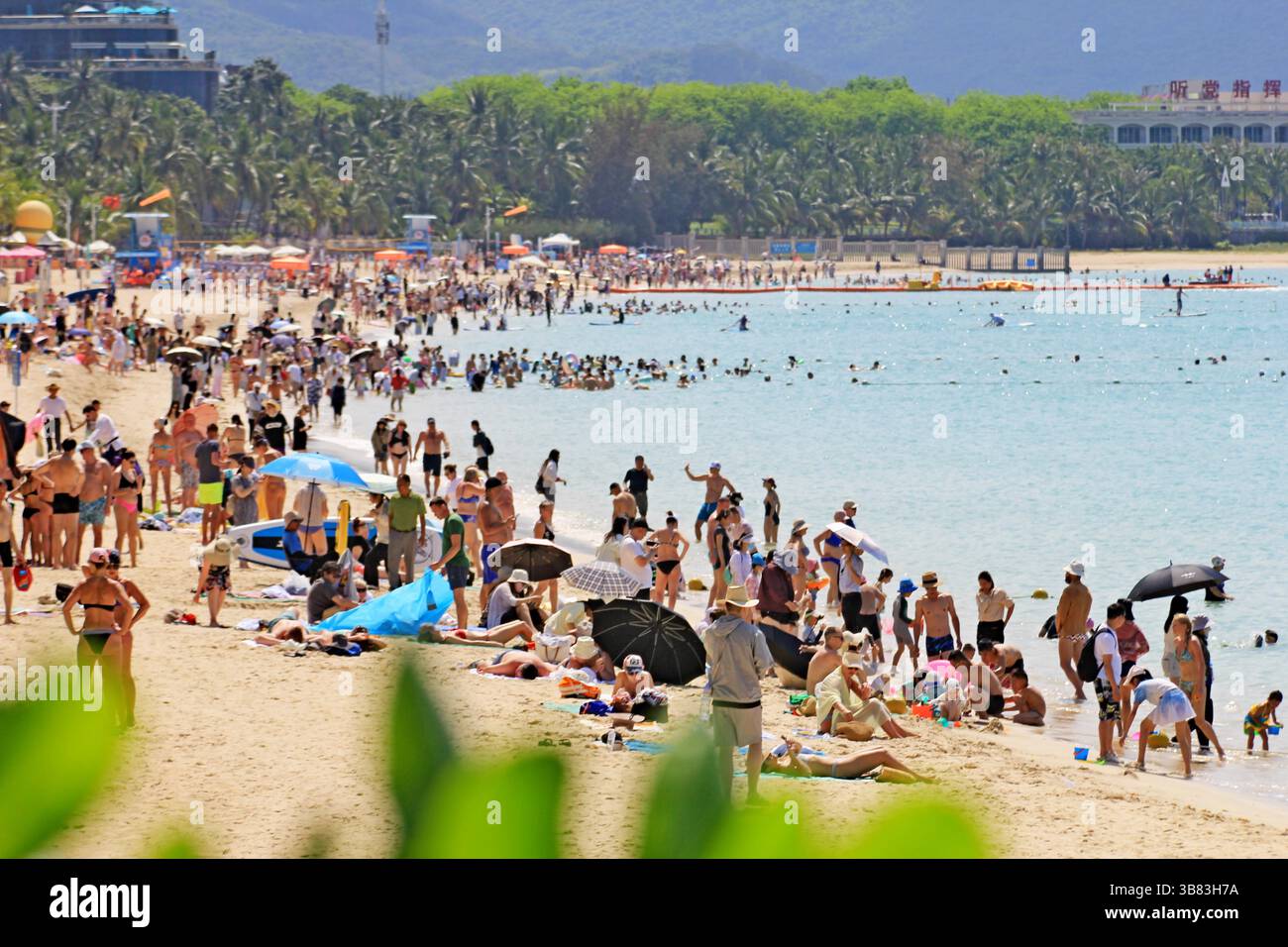 Tourists enjoy May Day vacation at Dadonghai Bay Scenic Area in Sanya ...