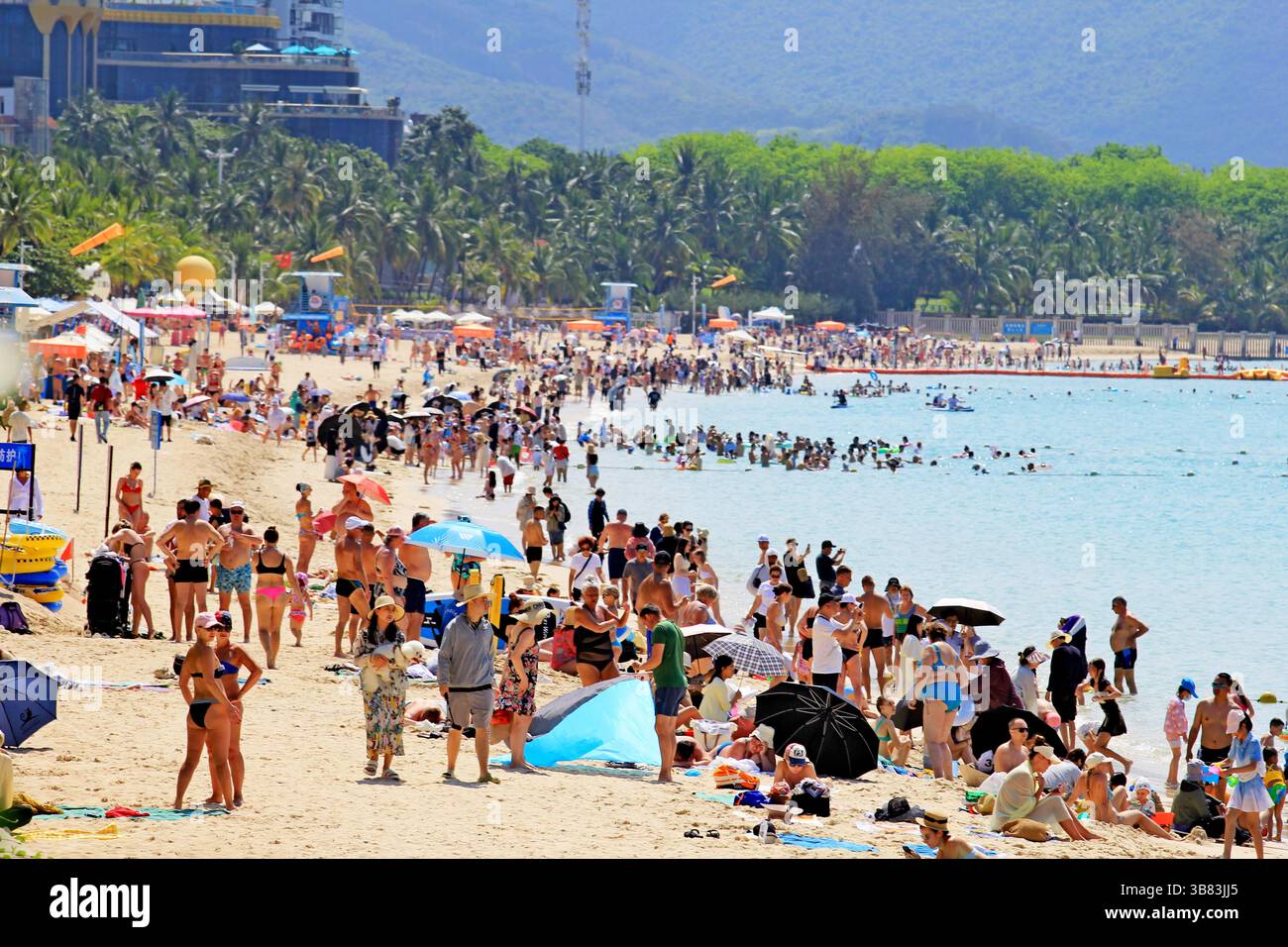 Tourists enjoy May Day vacation at Dadonghai Bay Scenic Area in Sanya ...