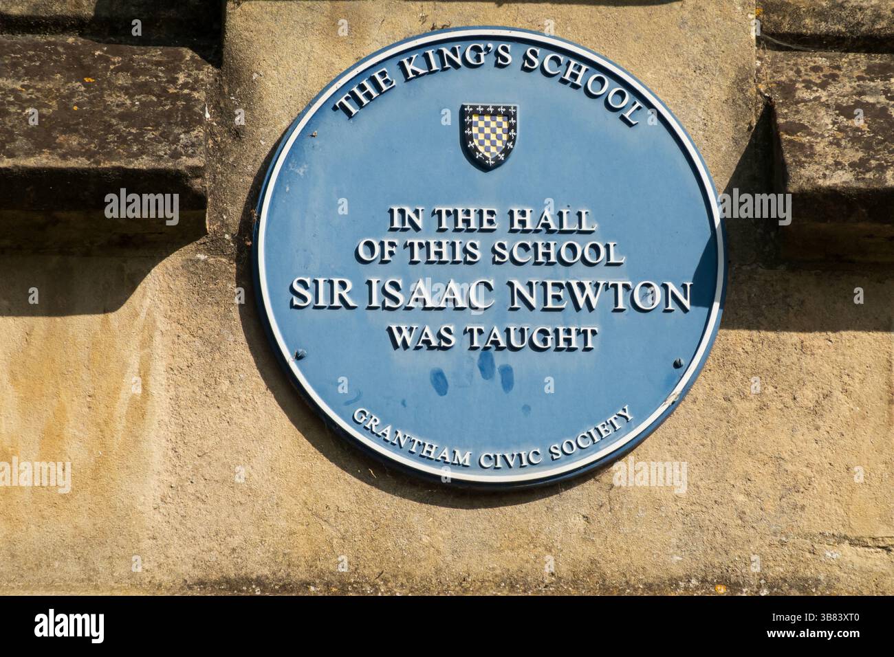 Blue plaque on the wall of the Kings School, where Sir Isaac Newton was ...