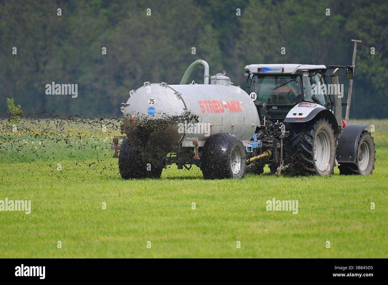 Gmund, Deutschland. 07th May, 2025. A tractor with a slurry tank ...