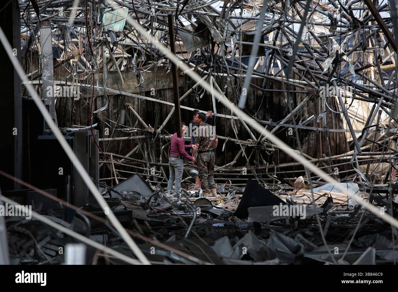 Yemeni officers inspect the damage following Israeli airstrikes on Sanaa International Airport ...