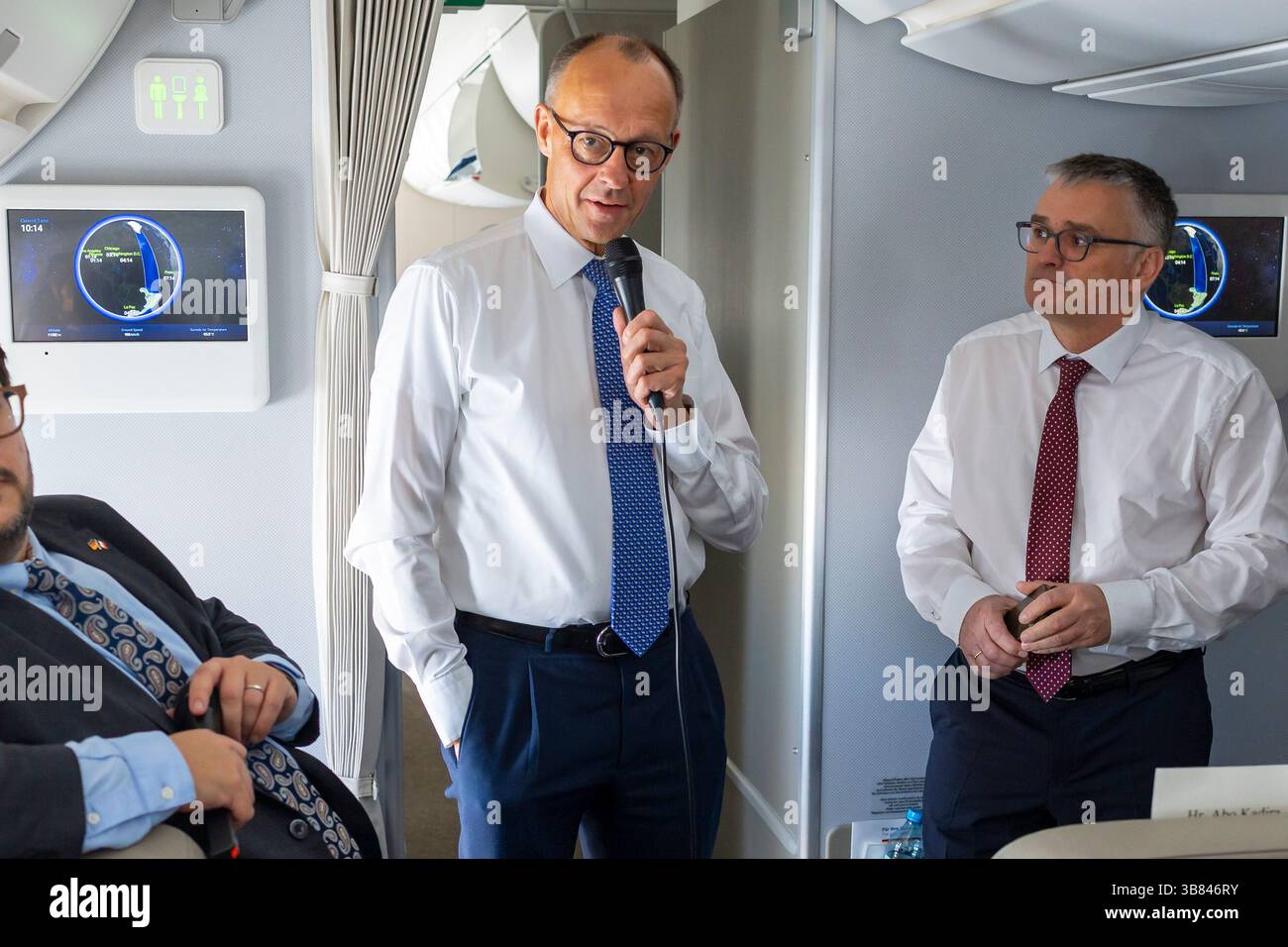 Chancellor Friedrich Merz (CDU) speaks with journalists aboard an ...
