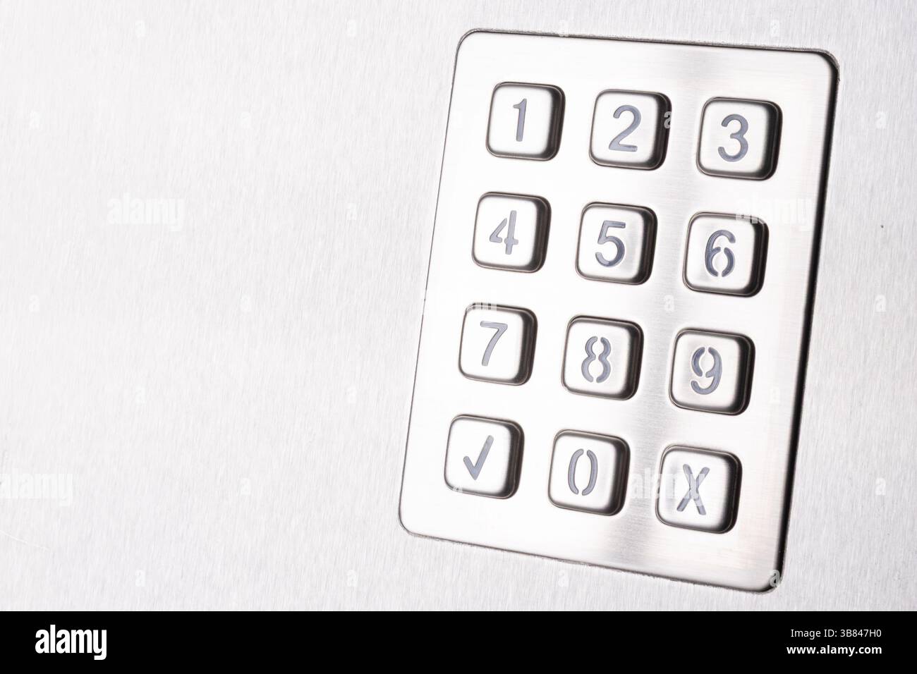 Tilted metallic numeric keypad panel Stock Photo - Alamy