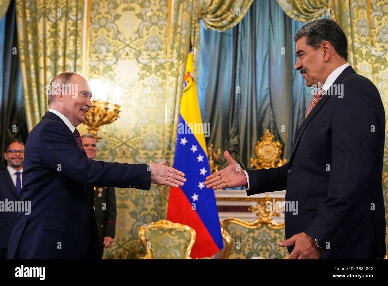 Russian President Vladimir Putin, left, shakes hands with Venezuelan ...