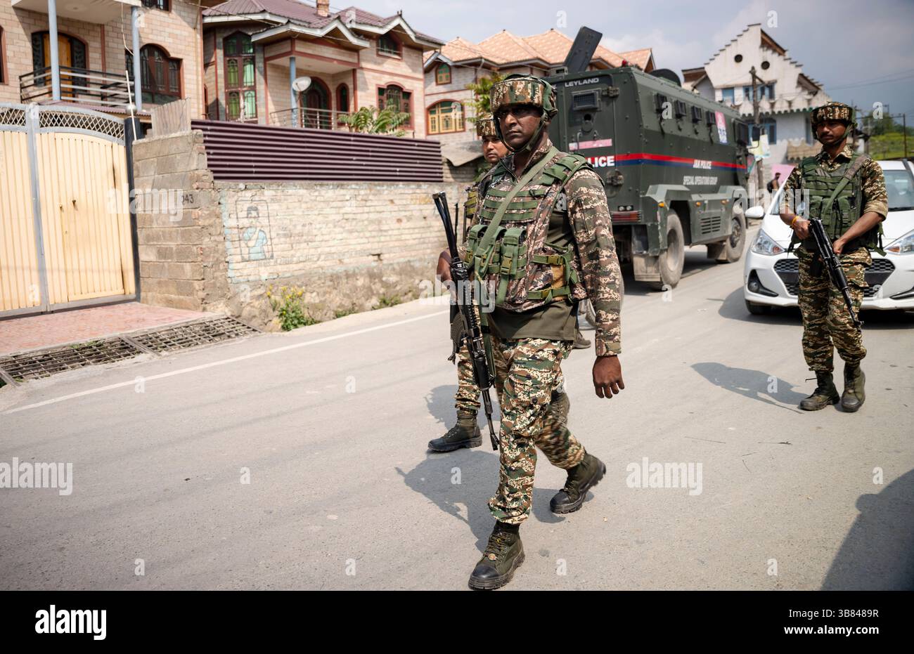 Indian security forces arrive at the site of an aircraft crash in the Wuyan area of Pampore ...
