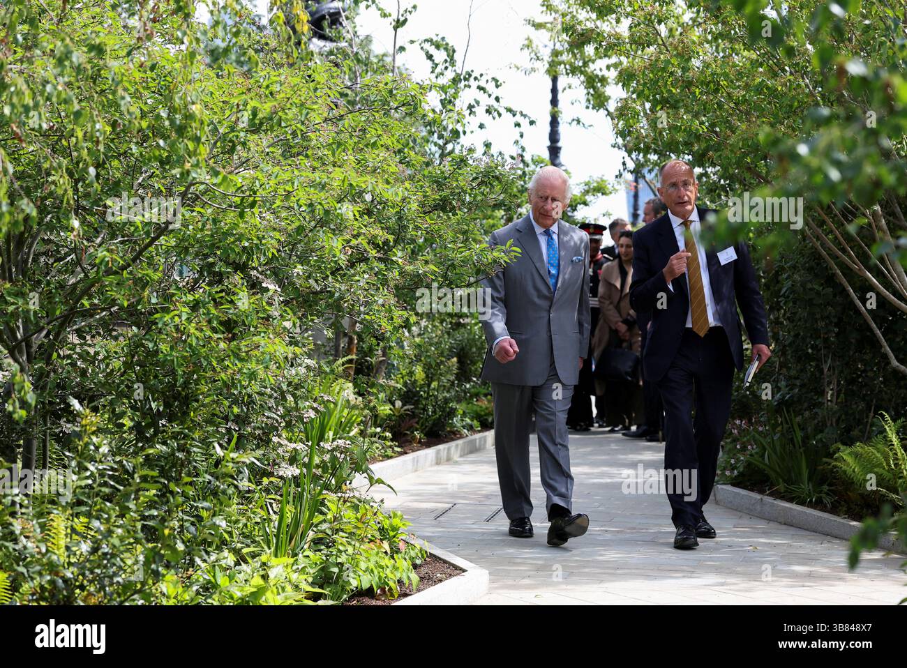 King Charles III walks with Andy Mitchell (right), CEO of Thames ...