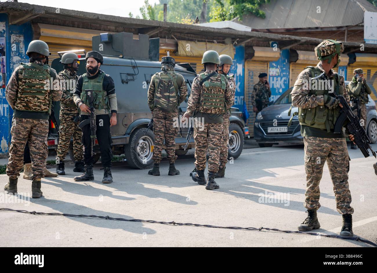 Indian security forces stand guard in wuyan area of Pampore. India and Pakistan engaged in ...