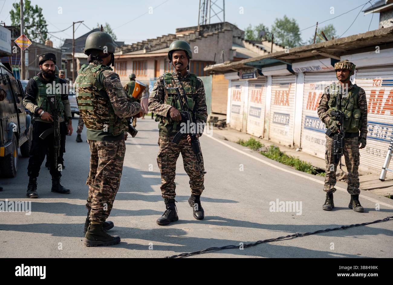 Indian security forces stand guard in wuyan area of Pampore. India and ...