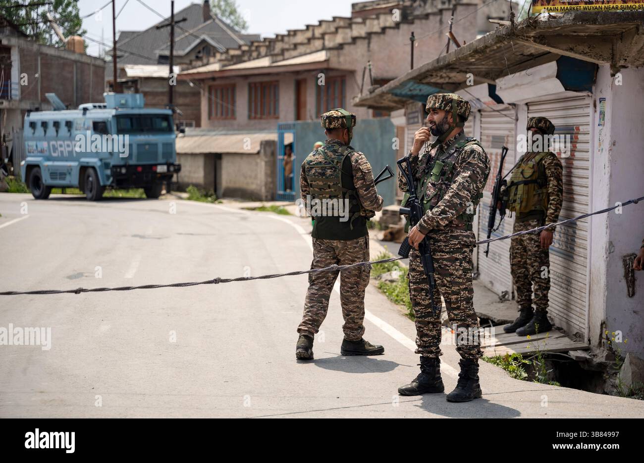 Indian security forces stand guard in wuyan area of Pampore. India and ...