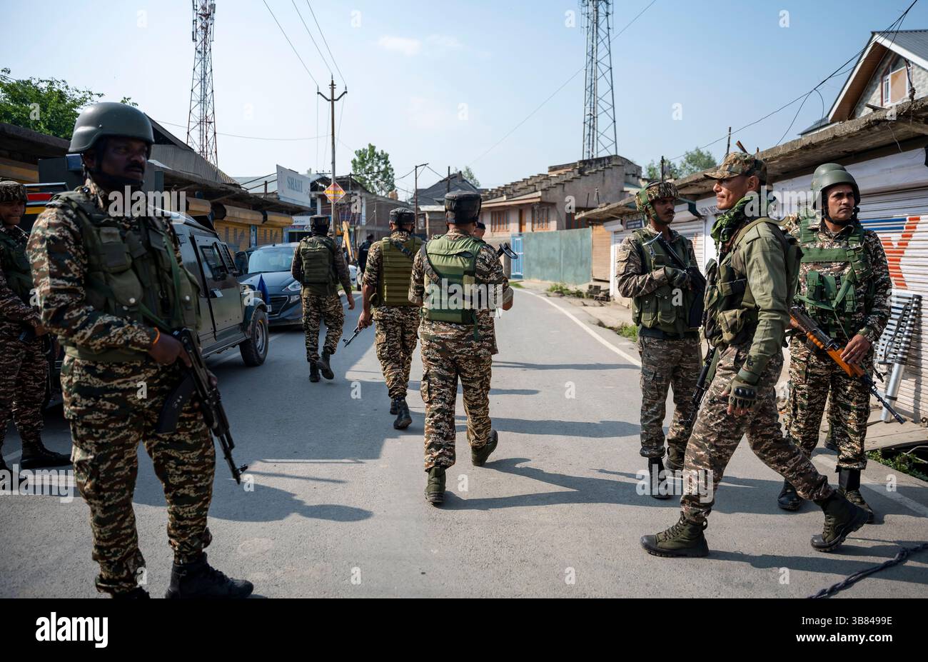 Indian security forces arrive at the site of an aircraft crash in the Wuyan area of Pampore ...