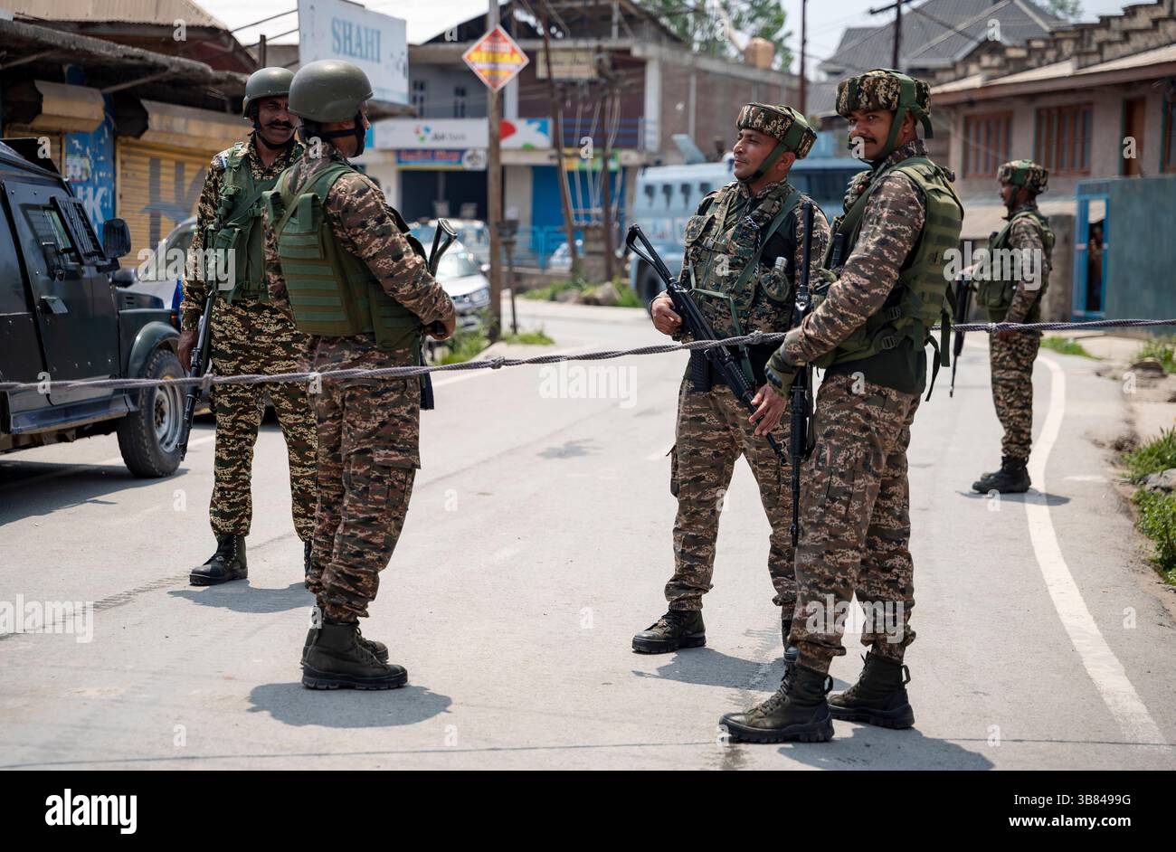 Indian security forces stand guard in wuyan area of Pampore. India and ...