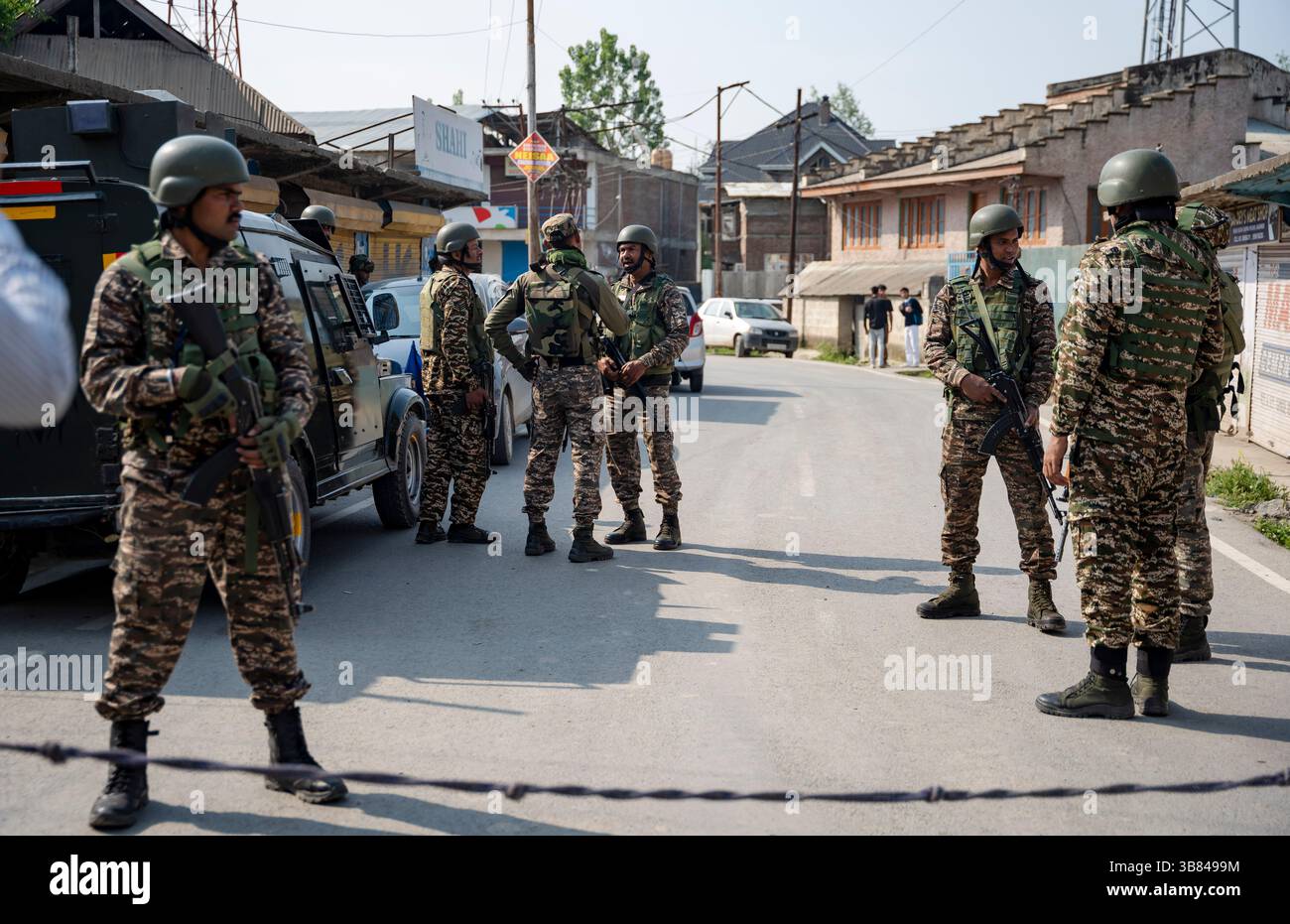 Indian security forces stand guard in wuyan area of Pampore. India and ...