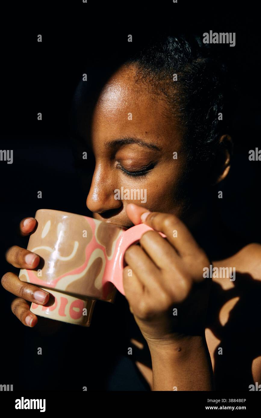 Woman sips coffee from hi-res stock photography and images - Alamy