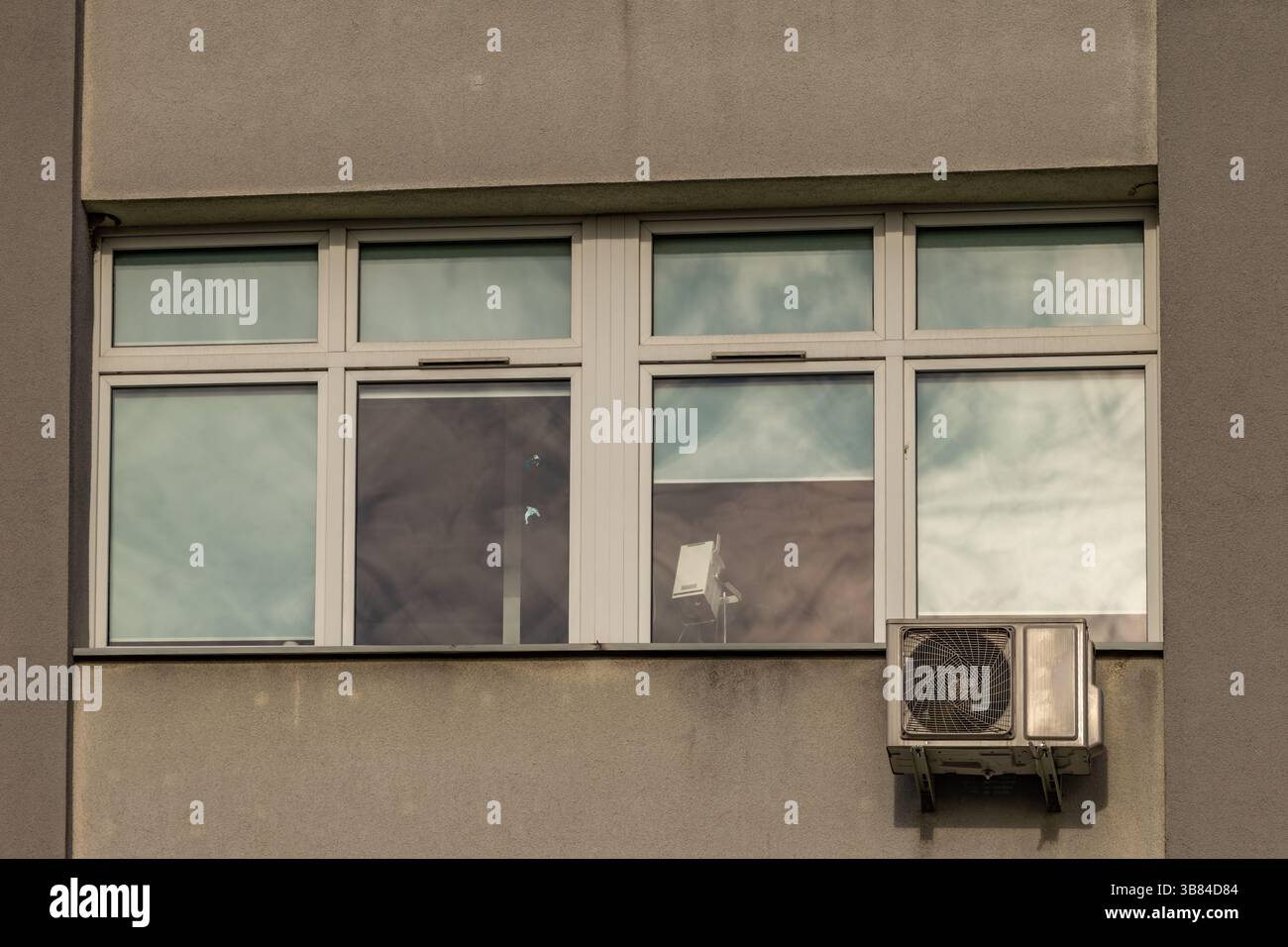 Air conditioner installed on the building facade, heat wave, air ...