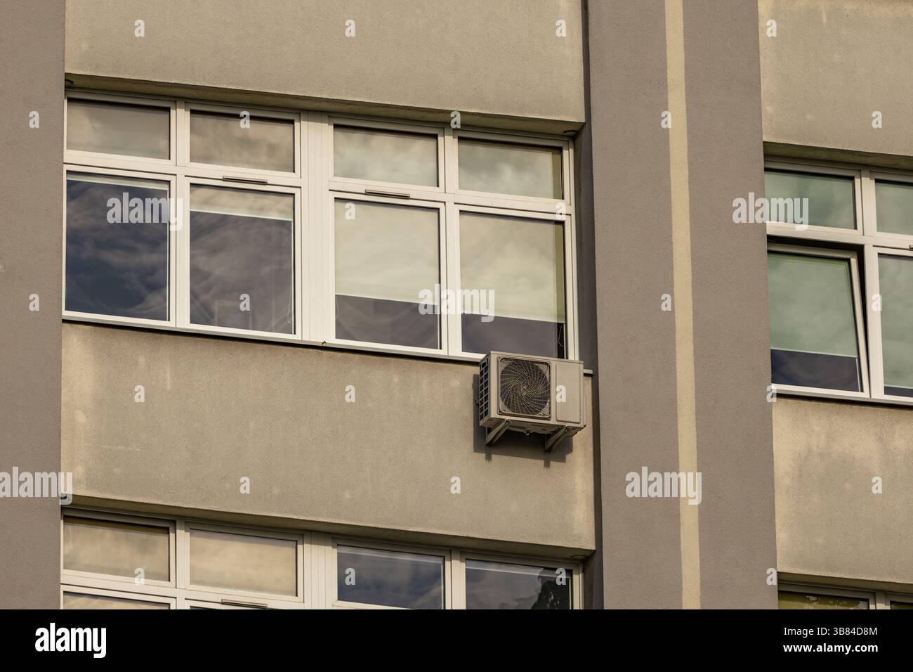 Air conditioner installed on the building facade, heat wave, air ...