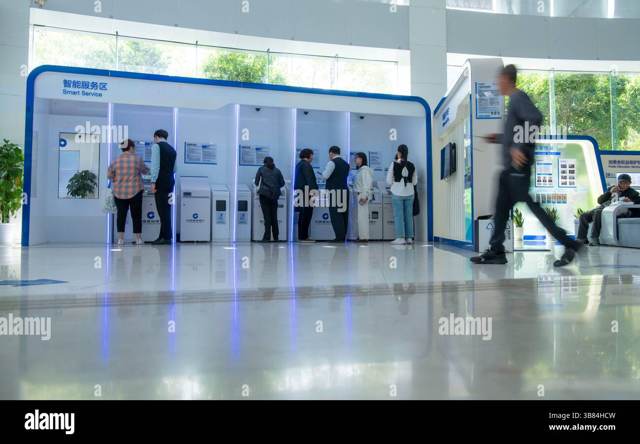 Customers conducted business in the cash business area of a bank in ...
