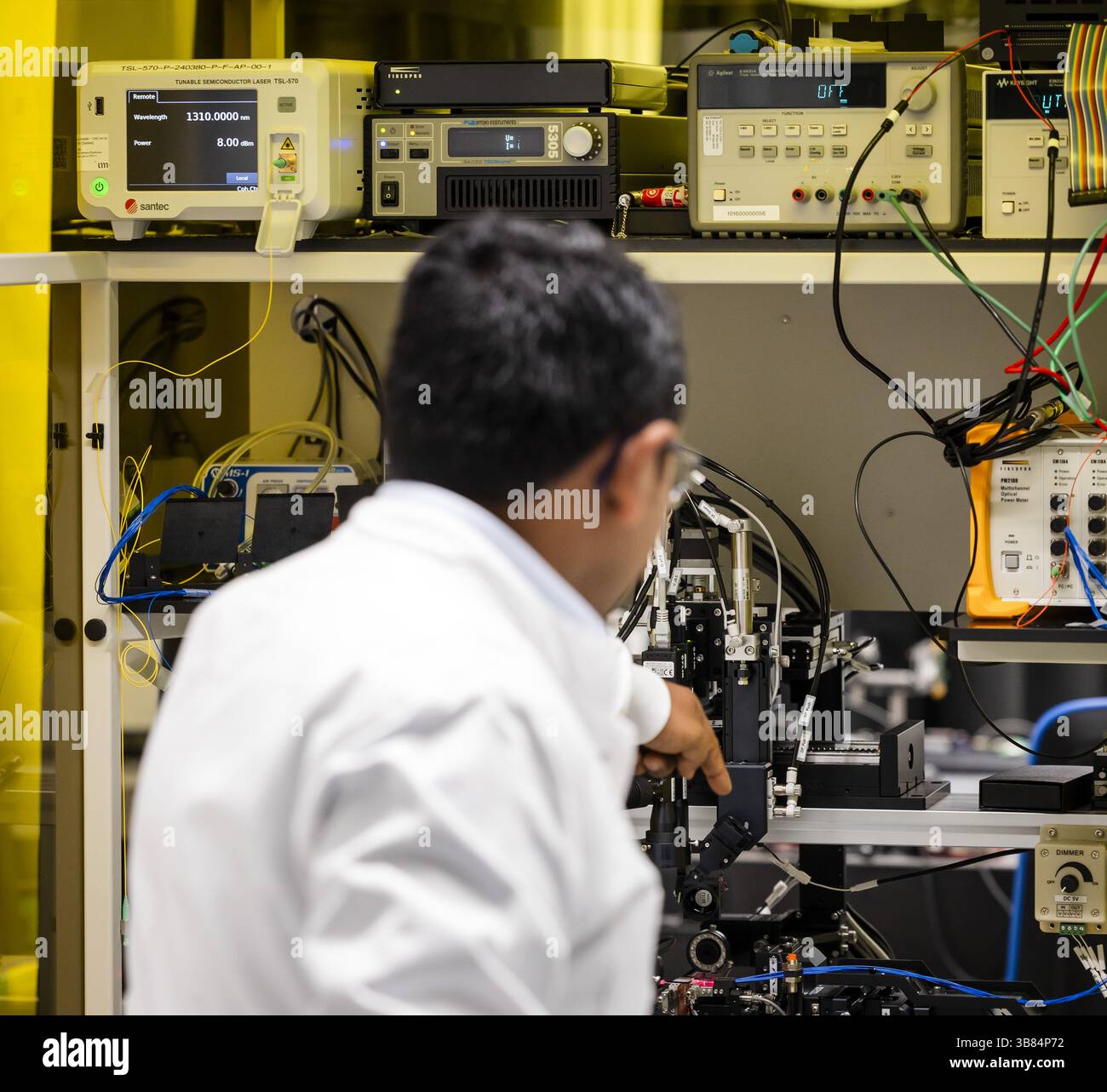 EINDHOVEN - An employee demonstrates work on photonic chips during a ...