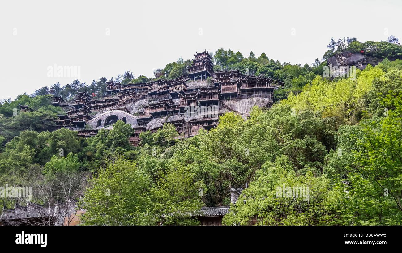 Traditional Chinese architecture nestled in the lush, mountainous ...